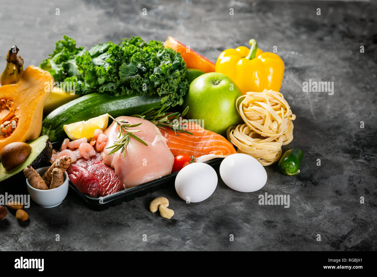 Balanced diet concept - fresh meat, fish, pasta, fruits and vegetables ...