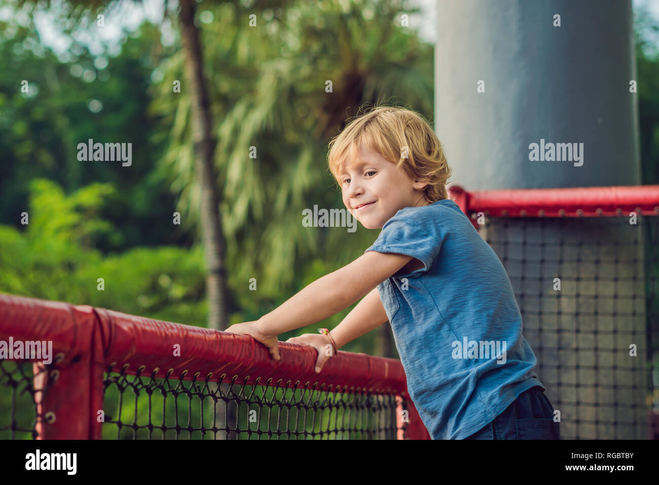 Adorable little toddler boy having fun on playground Stock Photo - Alamy