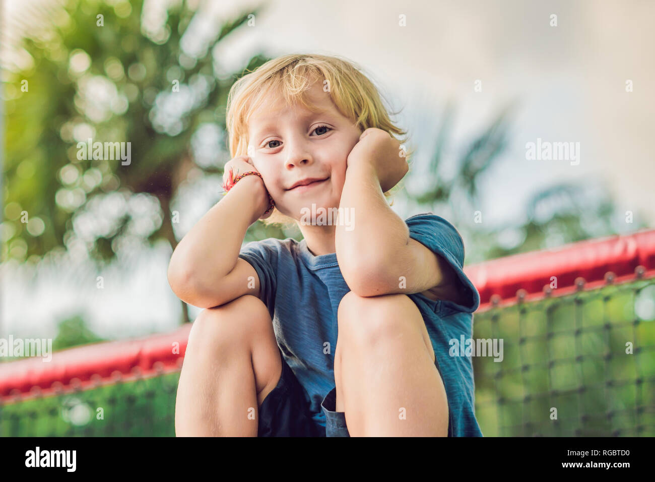 Adorable little toddler boy having fun on playground Stock Photo - Alamy