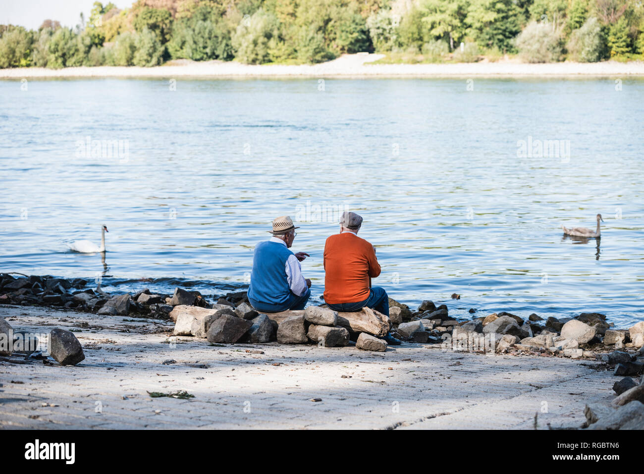 Old friends sitting riverside hi-res stock photography and images - Alamy