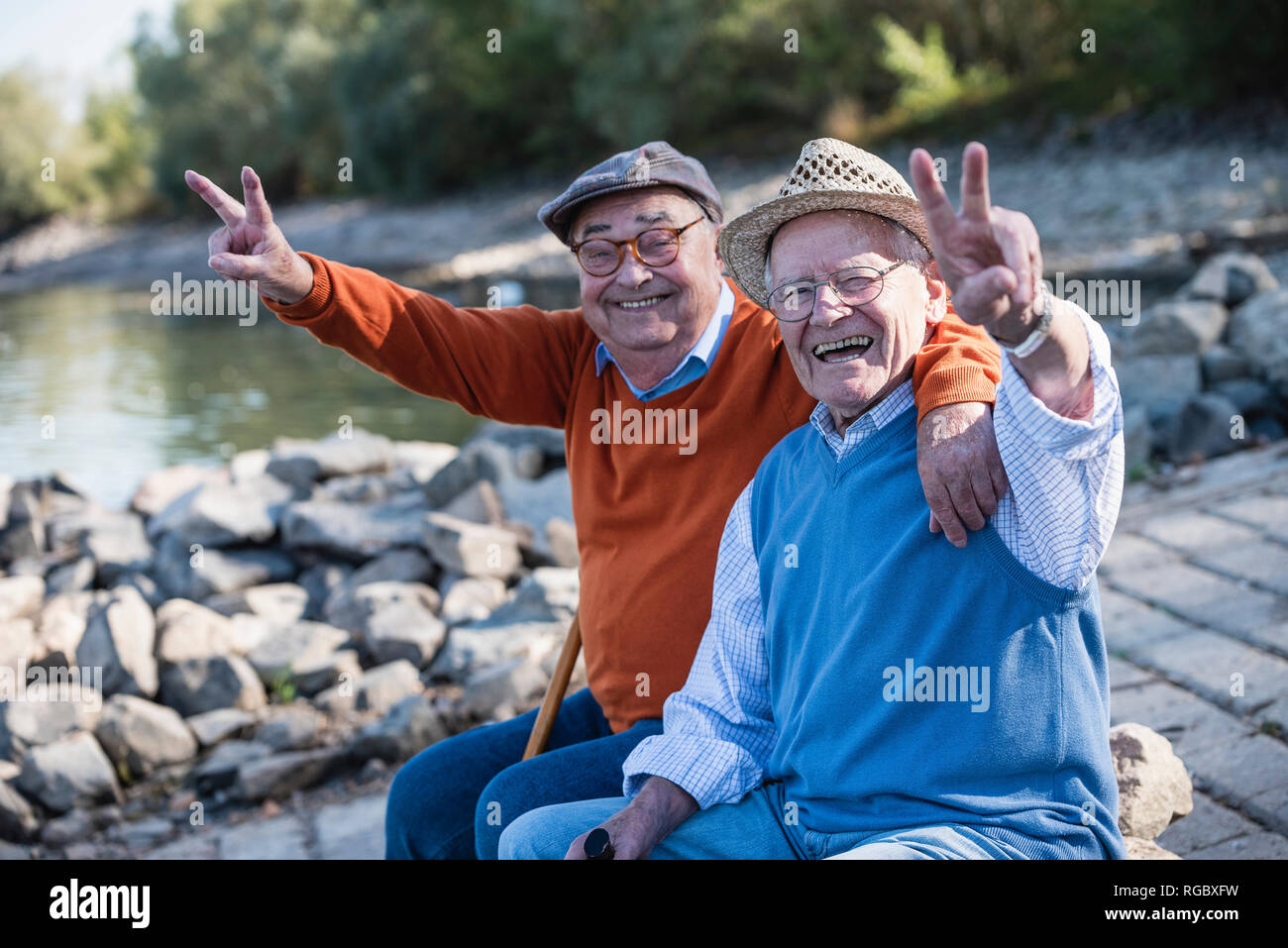 Old friends sitting riverside hi-res stock photography and images - Alamy