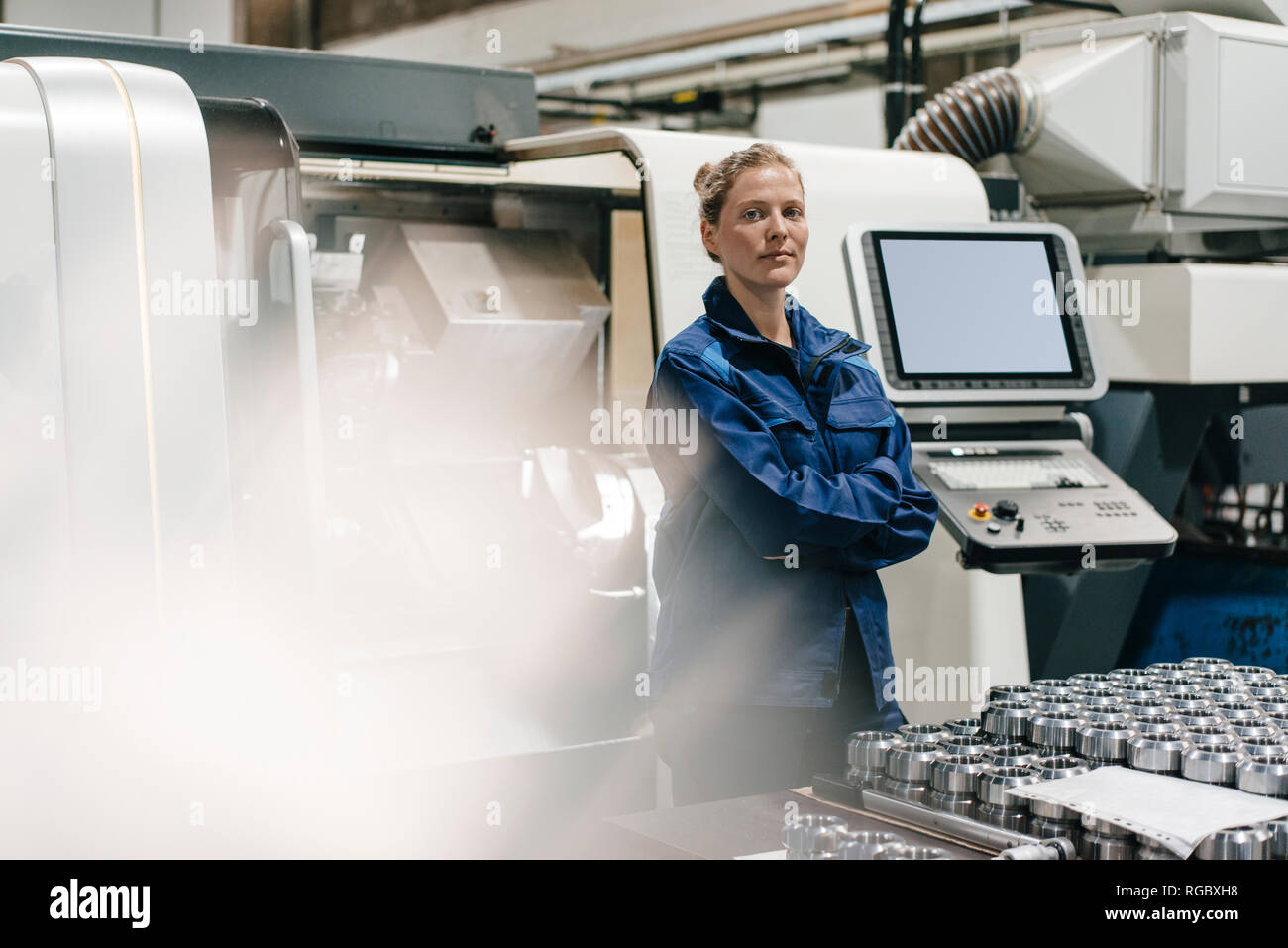Young woman working as a skilled worker in a high tech company ...