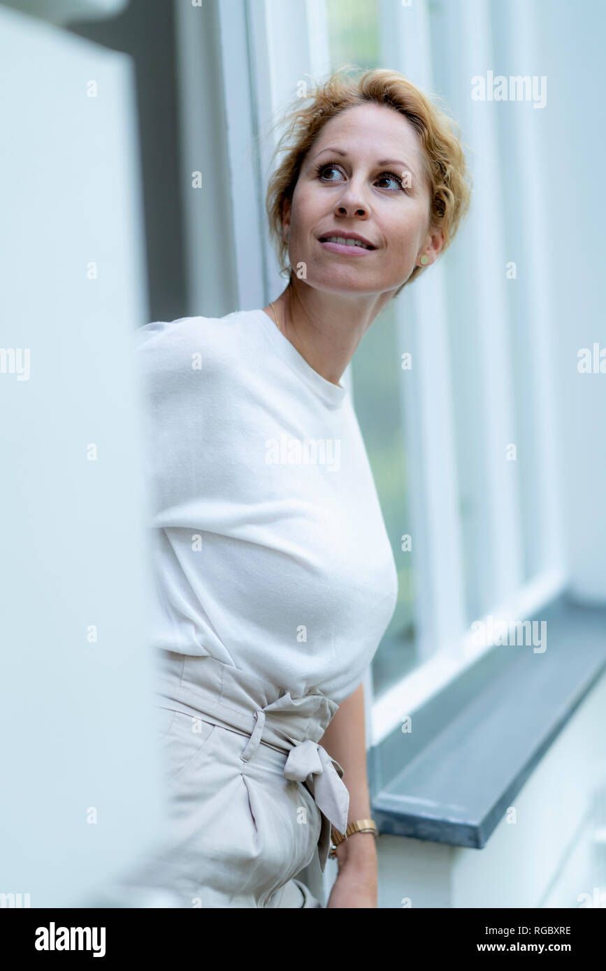 Portrait of woman watching something Stock Photo - Alamy