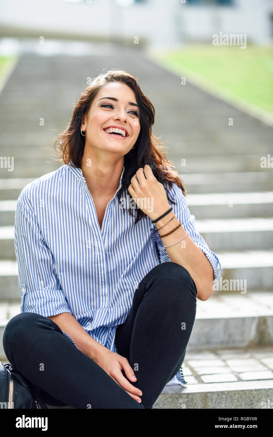 Portrait laughing student sitting stairs hi-res stock photography and images - Alamy