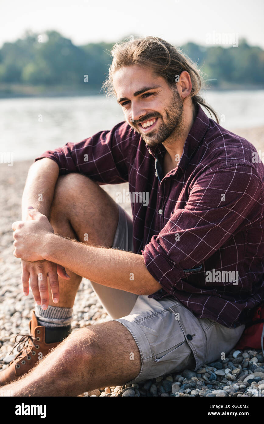 Man sitting by the riverside hi-res stock photography and images - Alamy