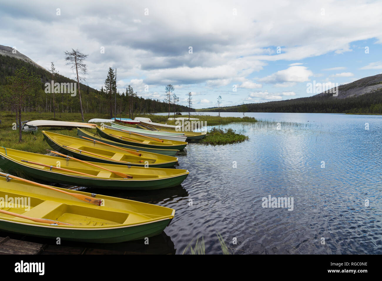 Finland, Lapland, rowing boats at the lakeside Stock Photo - Alamy