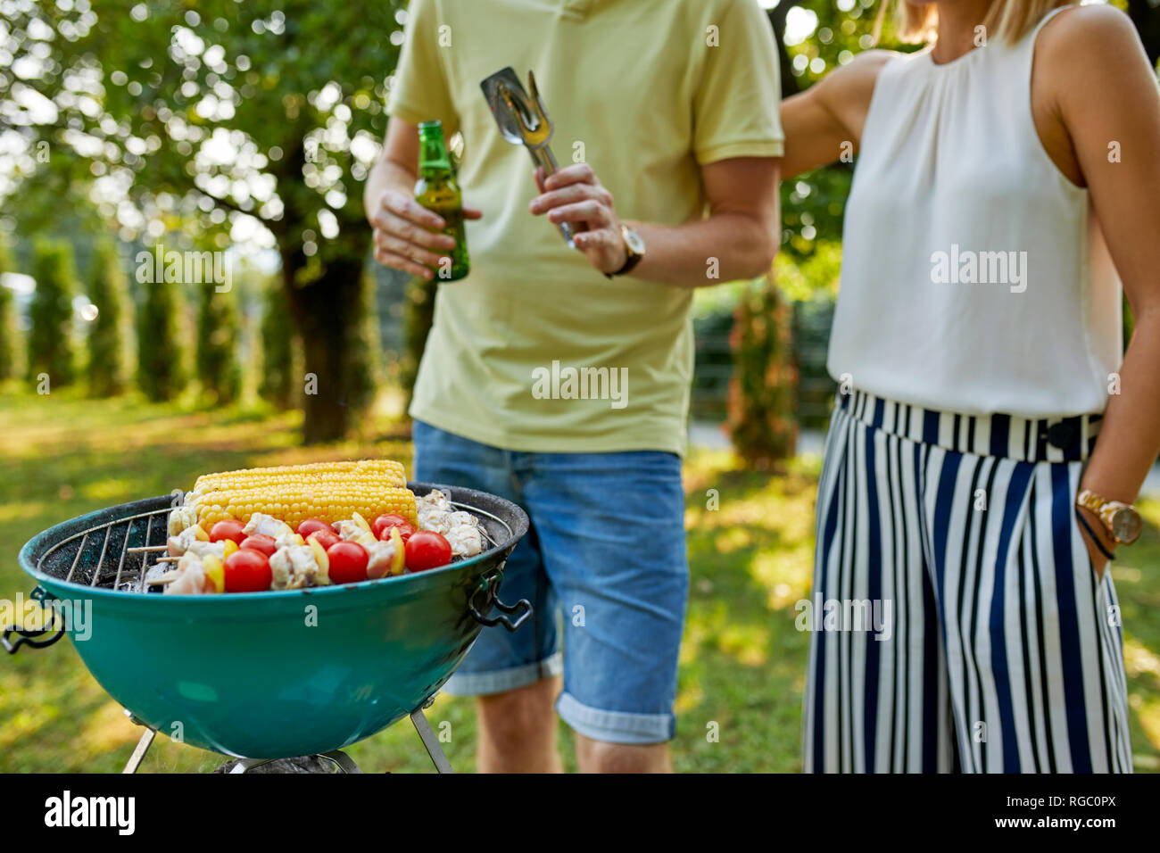 Young couple having barbecue garden hi-res stock photography and images ...