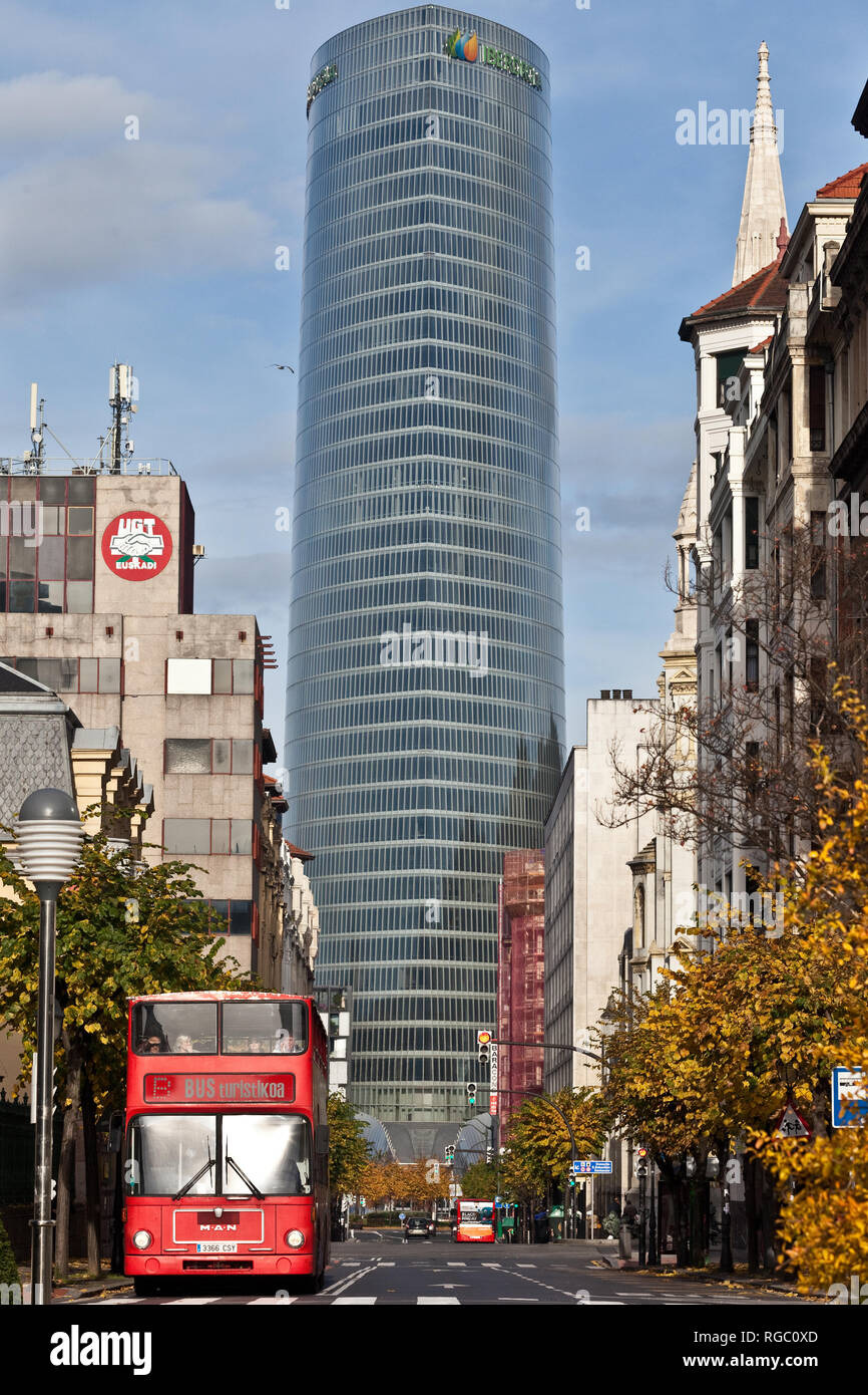 The Iberdrola high rise building and double decker tourist bus in ...