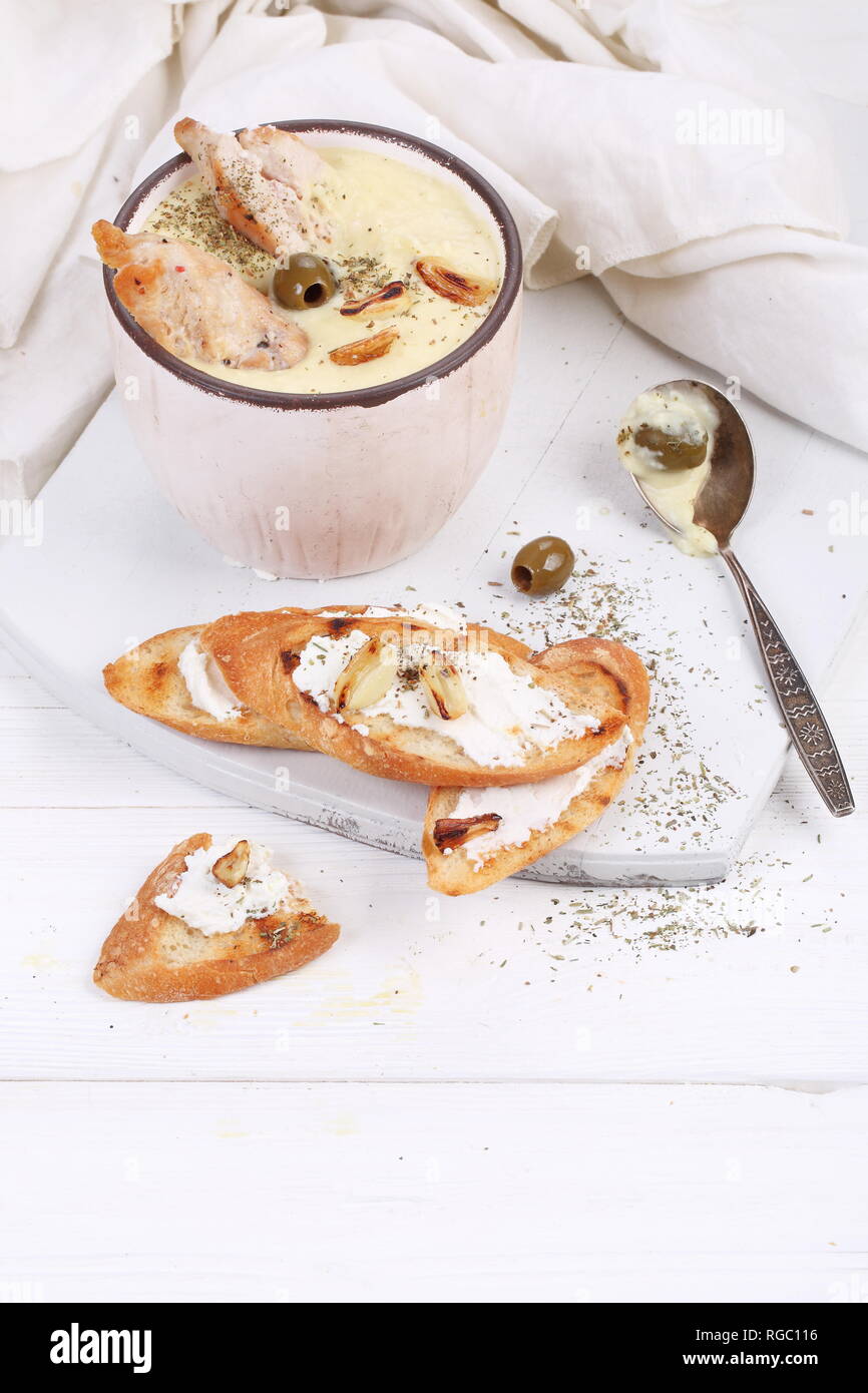 French puree soup with parsnip, soft cheese baguette Stock Photo - Alamy