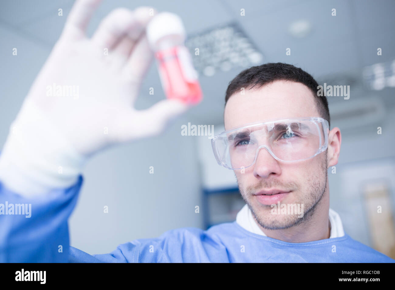 Scientist looking sample in lab hi-res stock photography and images - Alamy