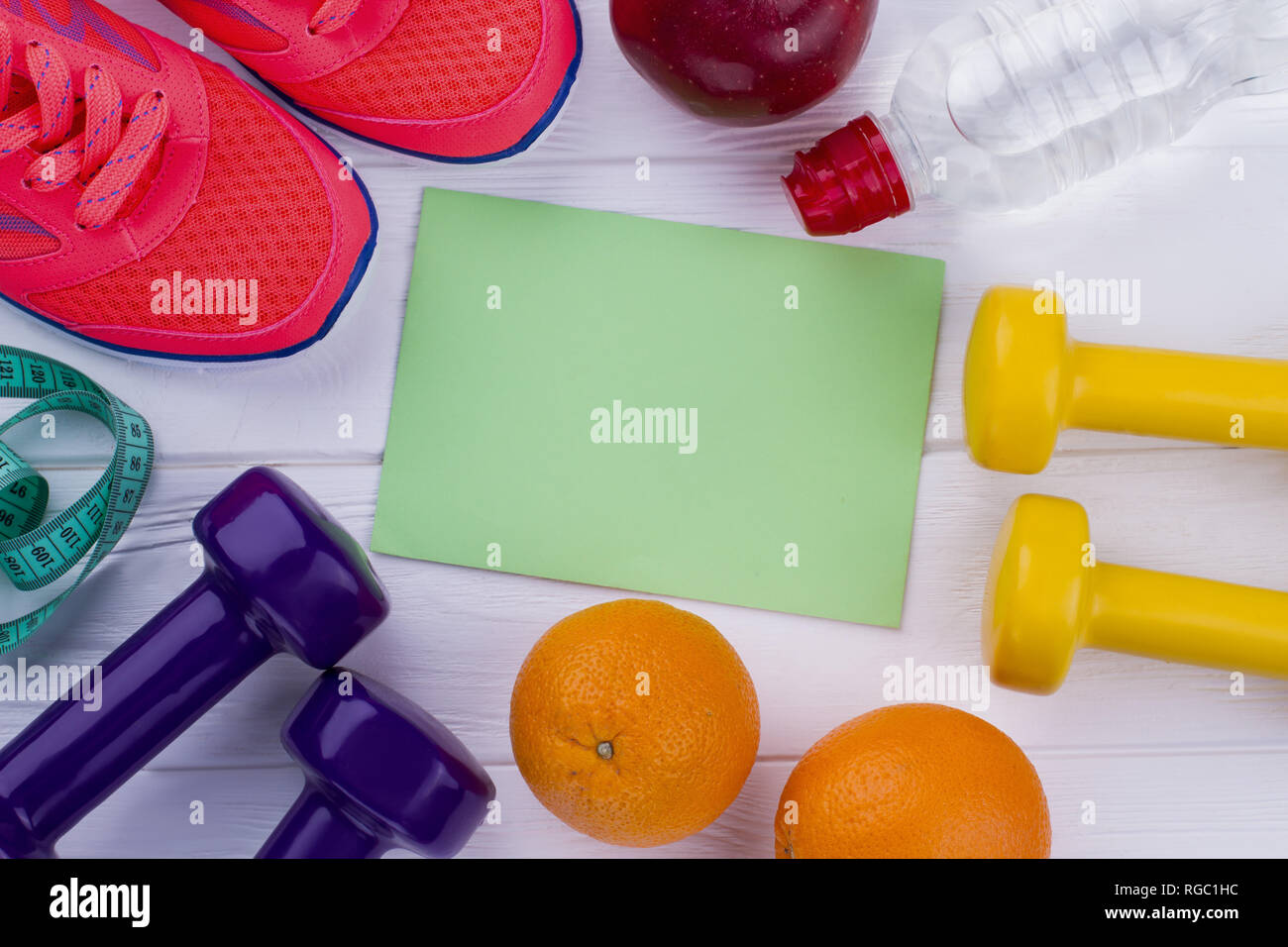 Healthy lifestyle concept. Fitness frame with sneakers, dumbbells ...