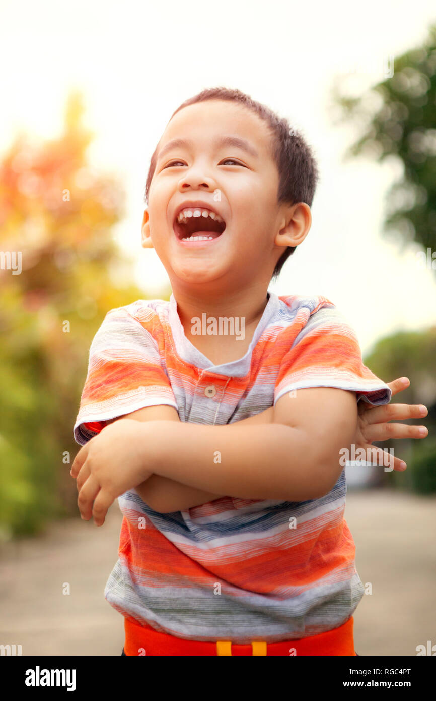 happiness emotion of asian children playing in green park Stock Photo ...