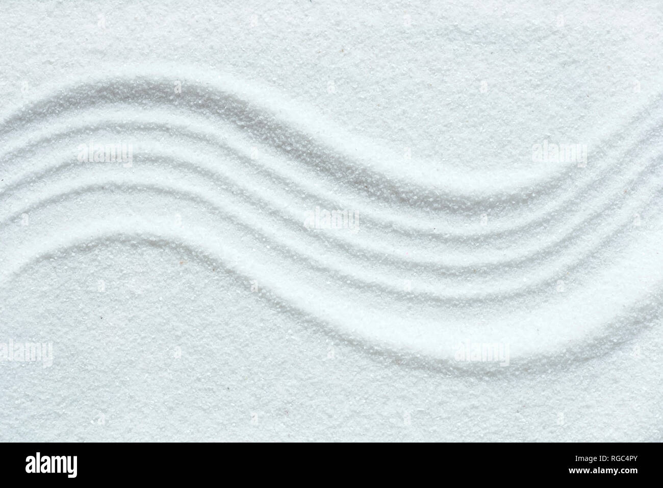 Zen pattern on white sand Stock Photo - Alamy