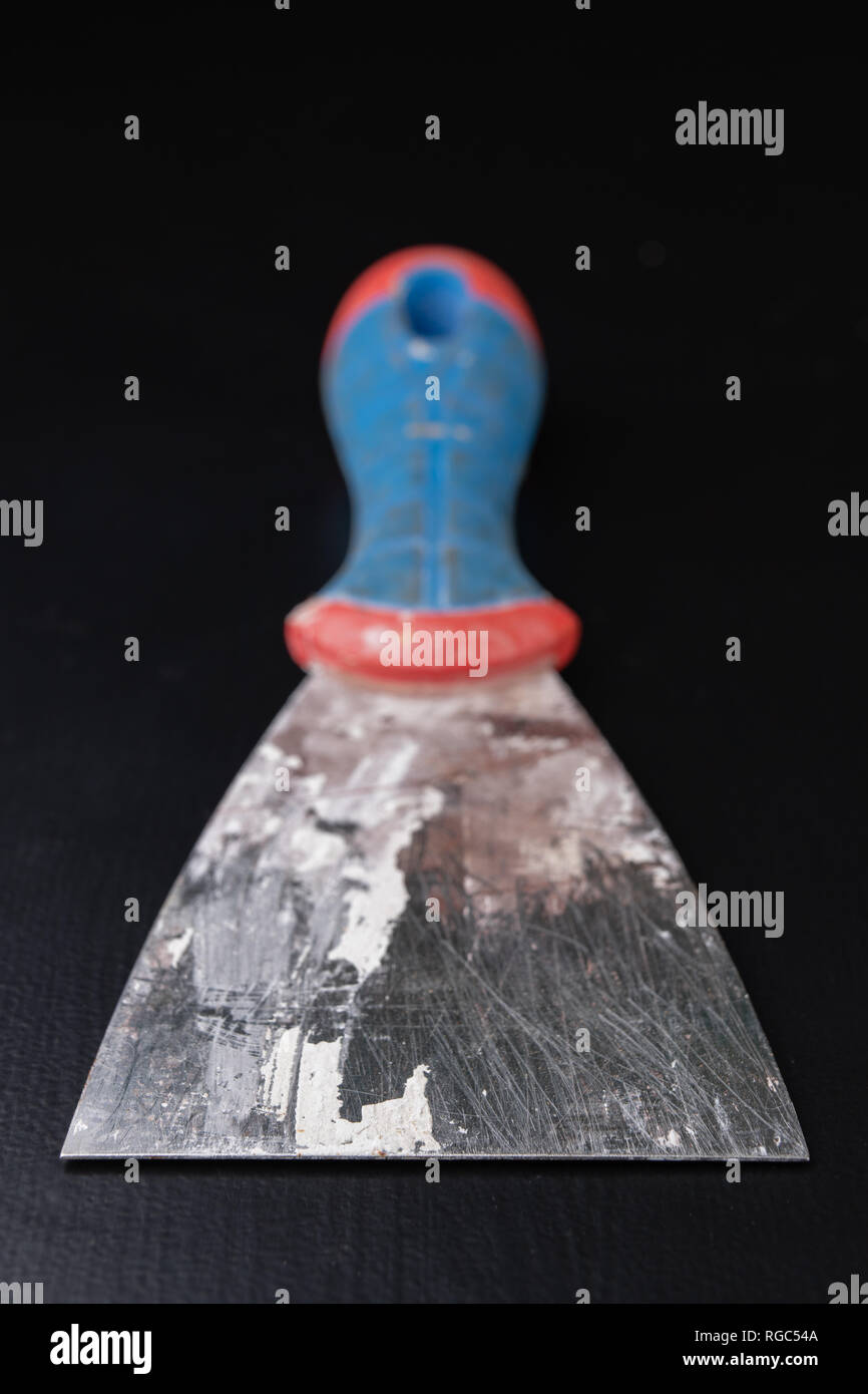 A dirty plastering plaster on a workshop table. Tools for construction ...