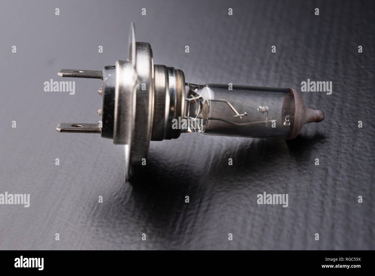 Burned car light. Old worn out car parts. Black background Stock Photo ...