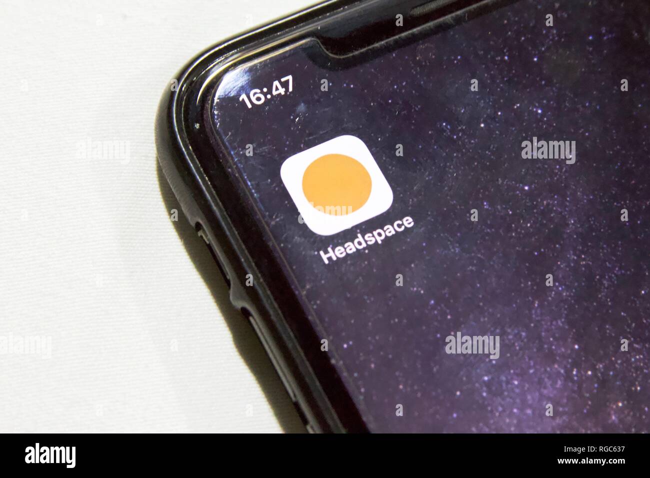 Headspace app, a meditation app, on an iPhone X on a white background ...