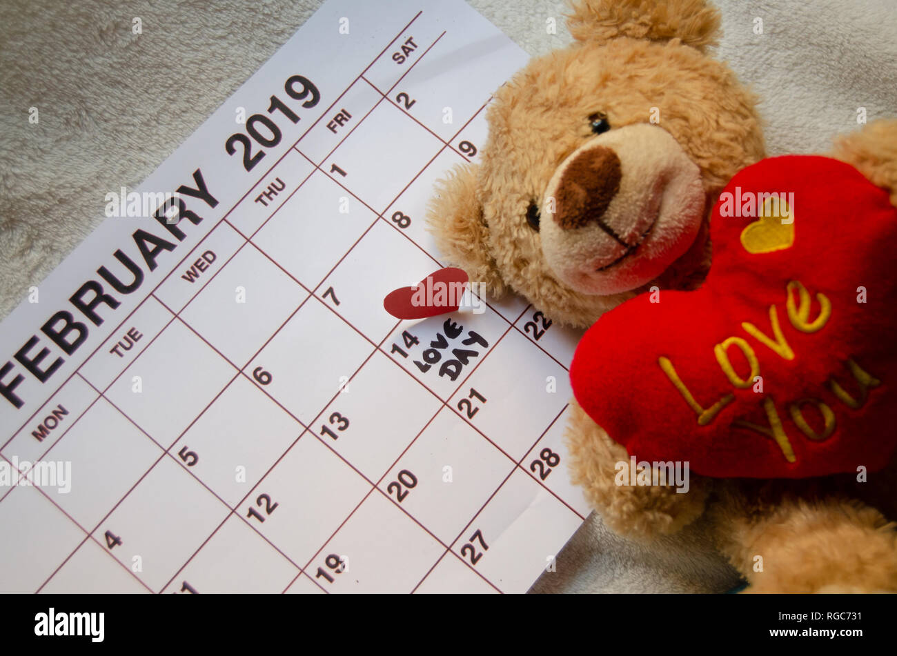 Love day - Paper red hearts marking 14 february Valentines day on white ...