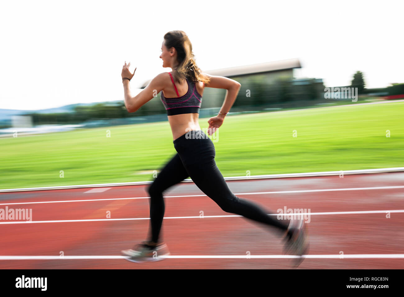 Teenage runner training on race track Stock Photo - Alamy