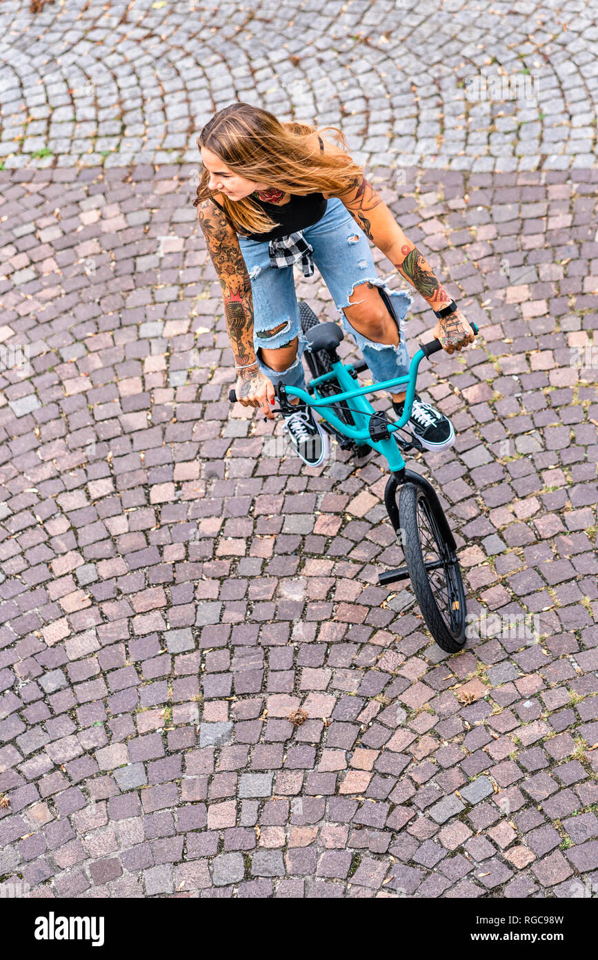 Young woman riding her BMX bike Stock Photo - Alamy