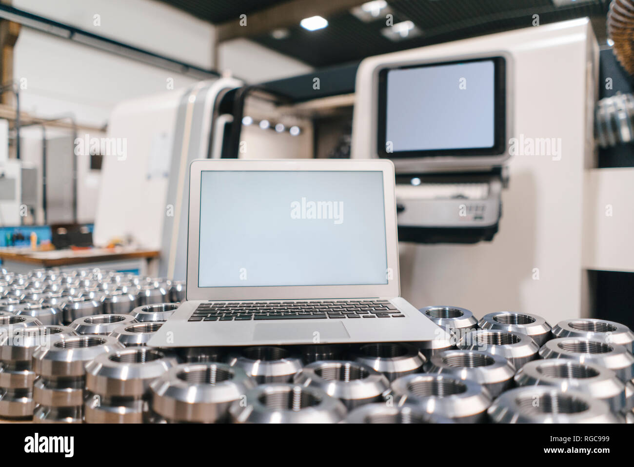 Laptop with blank screen in factory workshop Stock Photo - Alamy