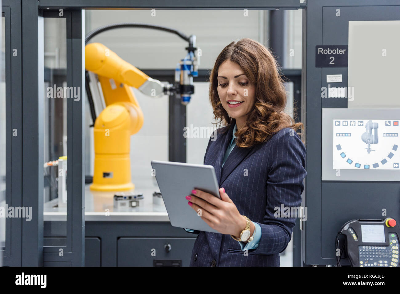 Businesswoman, working in high tech company, using digital tablet Stock ...