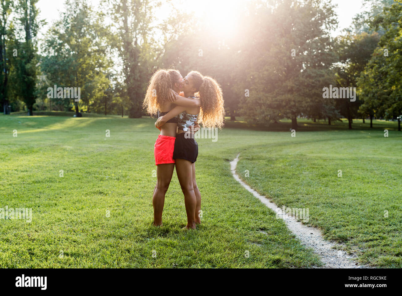 Twin sisters hugging other in hi-res stock photography and images - Alamy