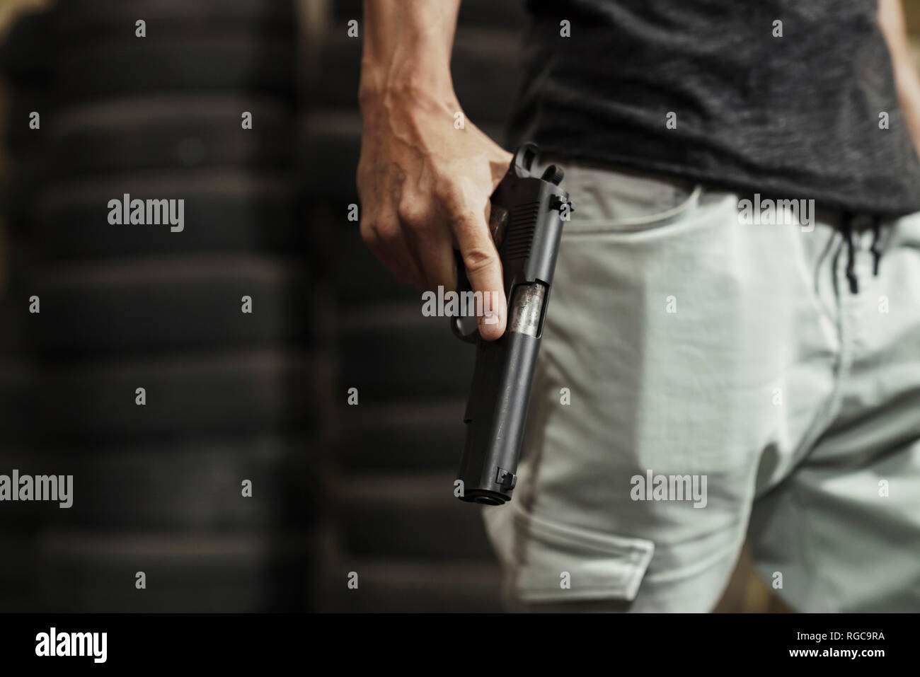 Man holding a pistol hi-res stock photography and images - Alamy