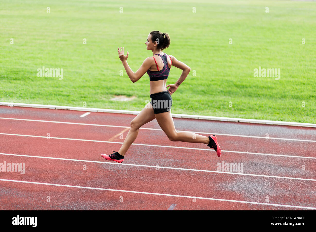 Teenage runner training on race track Stock Photo - Alamy