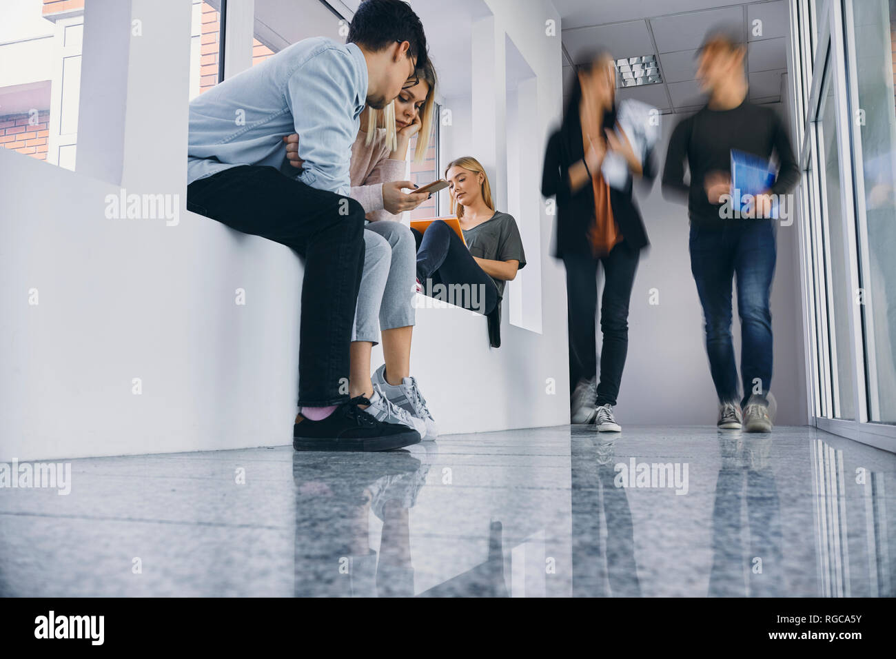 Group of students in hallway Stock Photo - Alamy