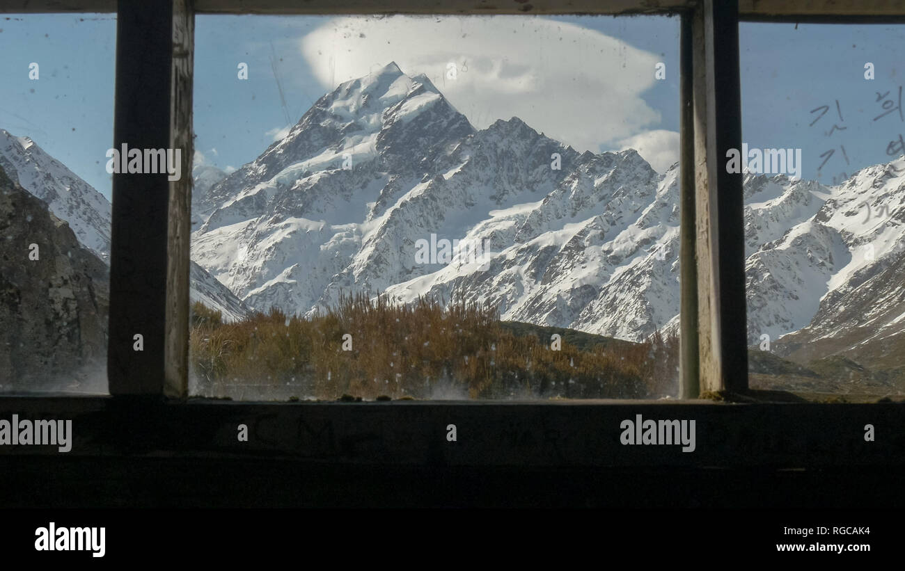mt cook looking through the windows of stocking stream shelter in new ...