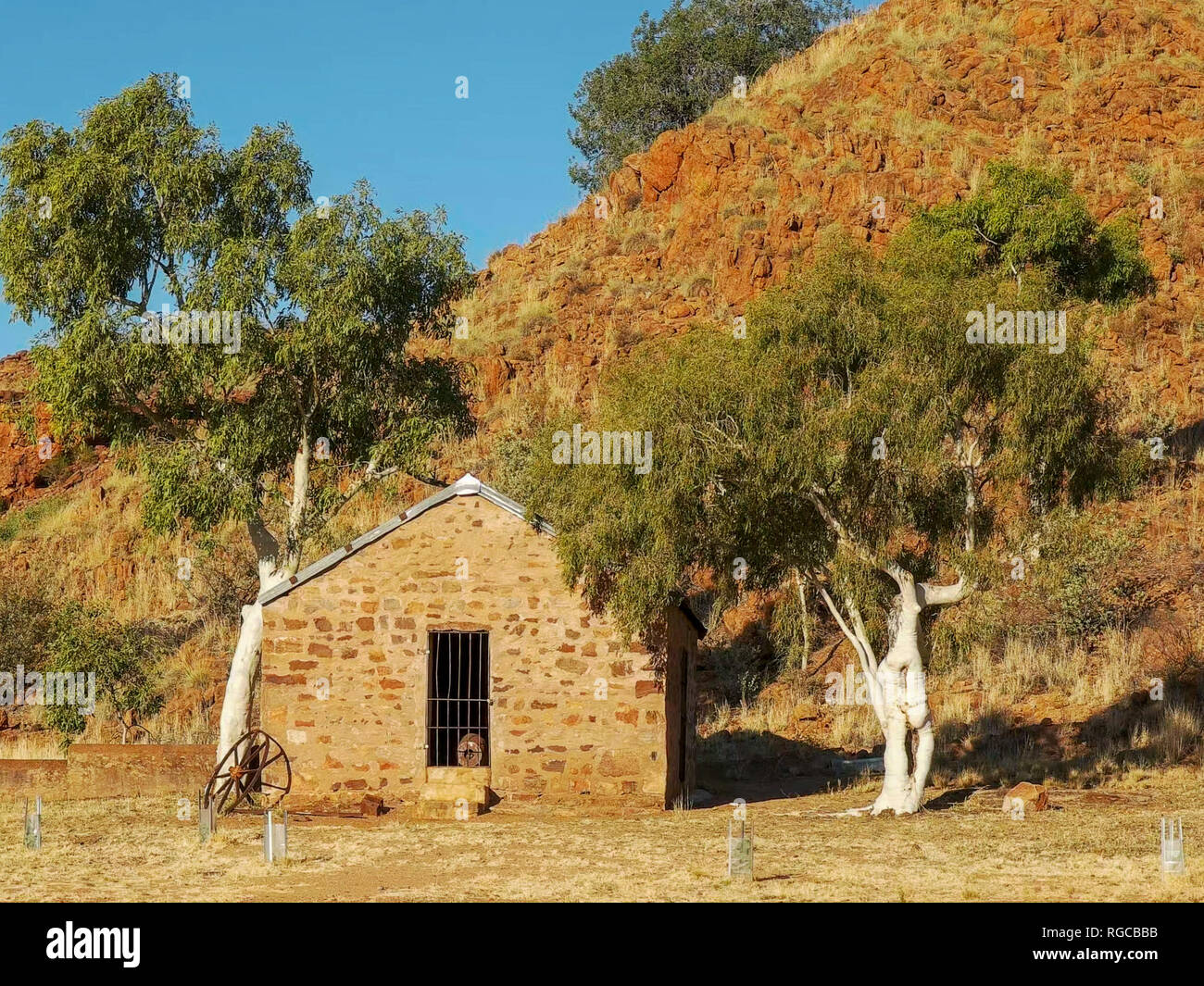 a view of an old hut and ghost gums at the overland telegraph station ...