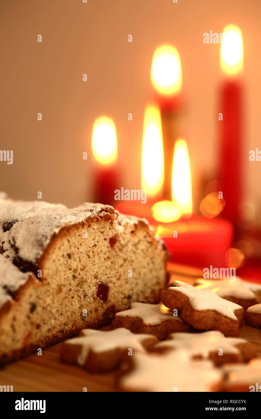 Cinnamon stars and stollen at candle light Stock Photo - Alamy