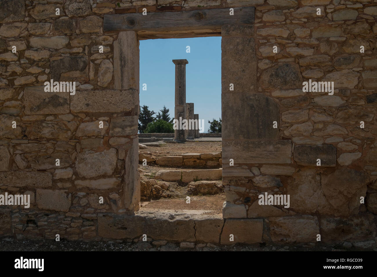 A doorway frames columns at the ancient Roman ruin at Kourion, Cyprus ...