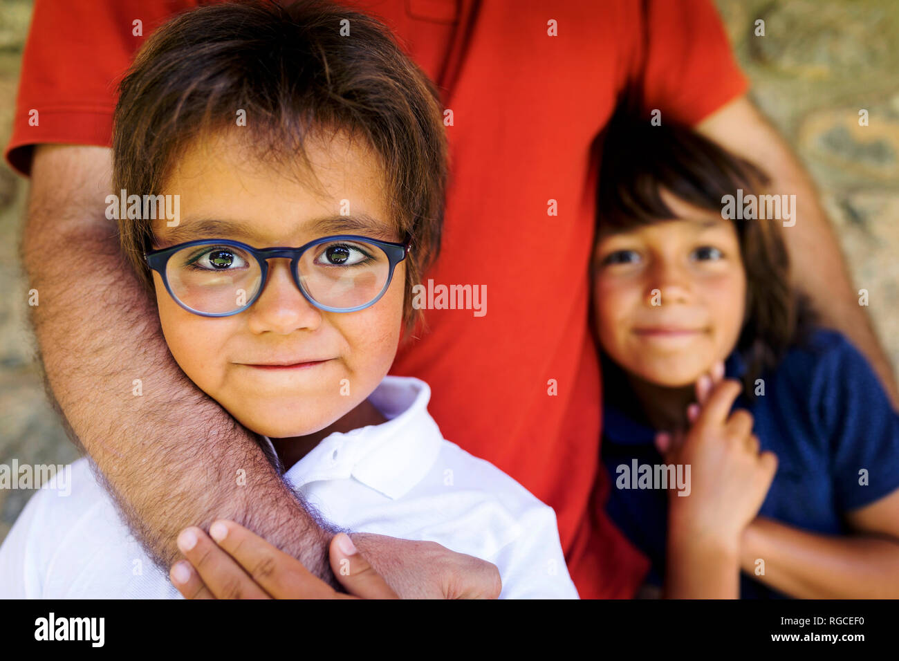 Portrait of little boy with father and older brother Stock Photo - Alamy