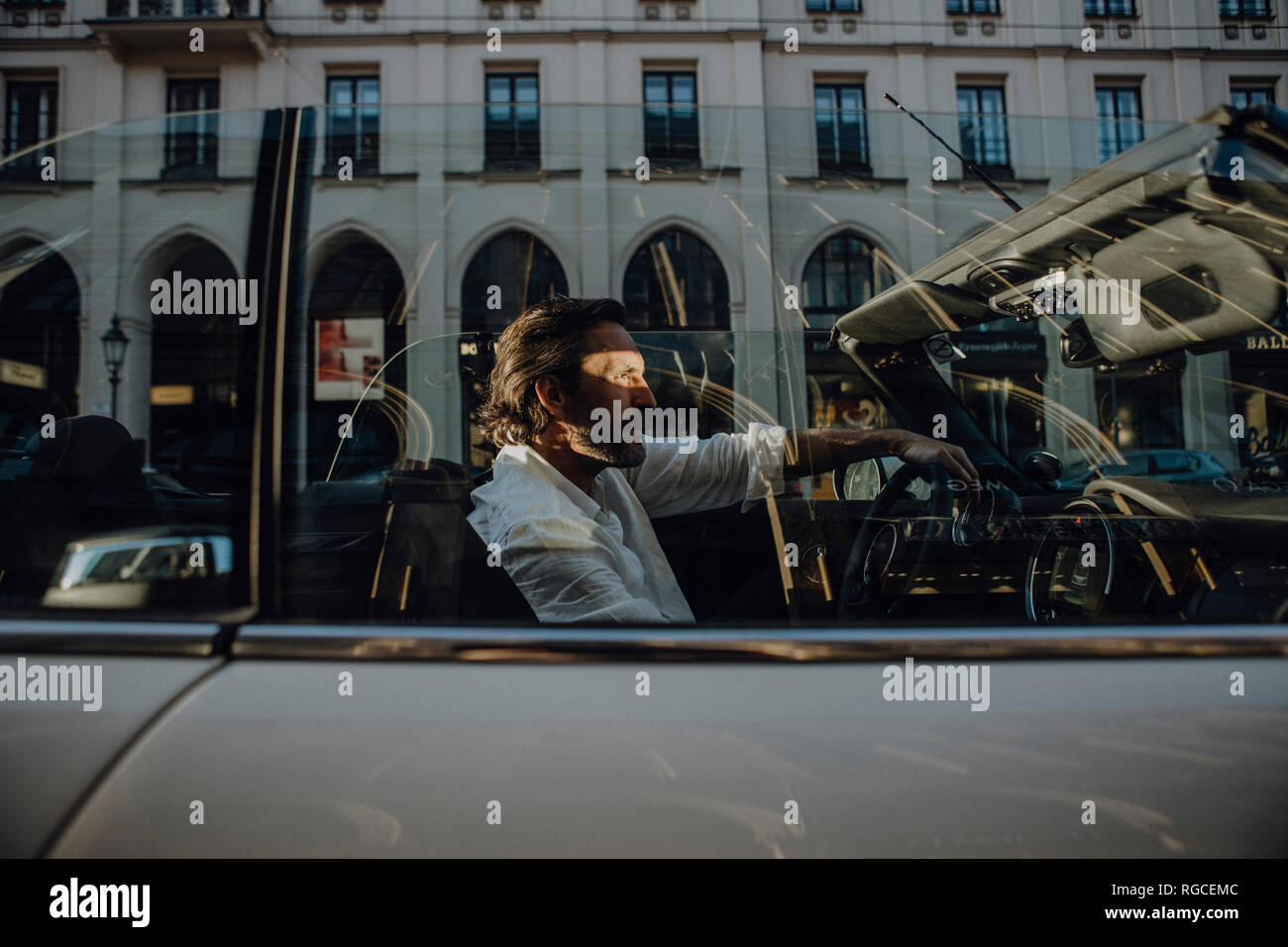 Man driving convertible in Munich, Bavaria, Germany Stock Photo - Alamy