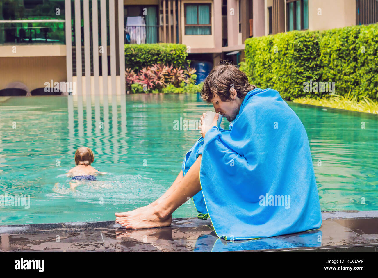 Sick man traveler. The man caught a cold on vacation, sits sad at the ...