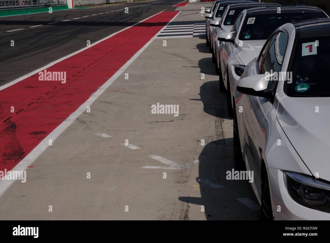 Row cars driving on road hi-res stock photography and images - Alamy