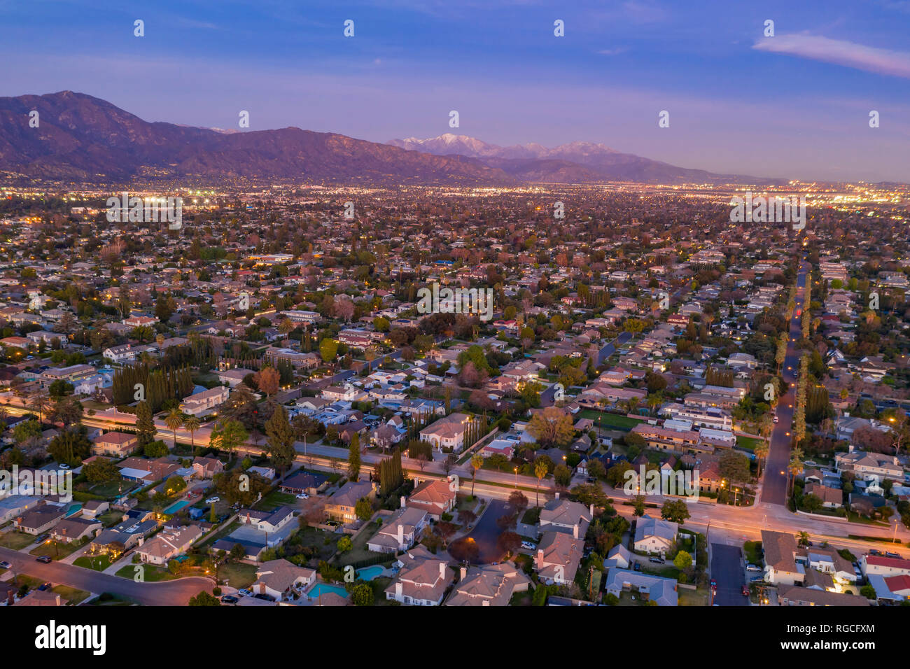 Aerial night view of the Arcadia area with the white snowy Mt. Baldy at ...