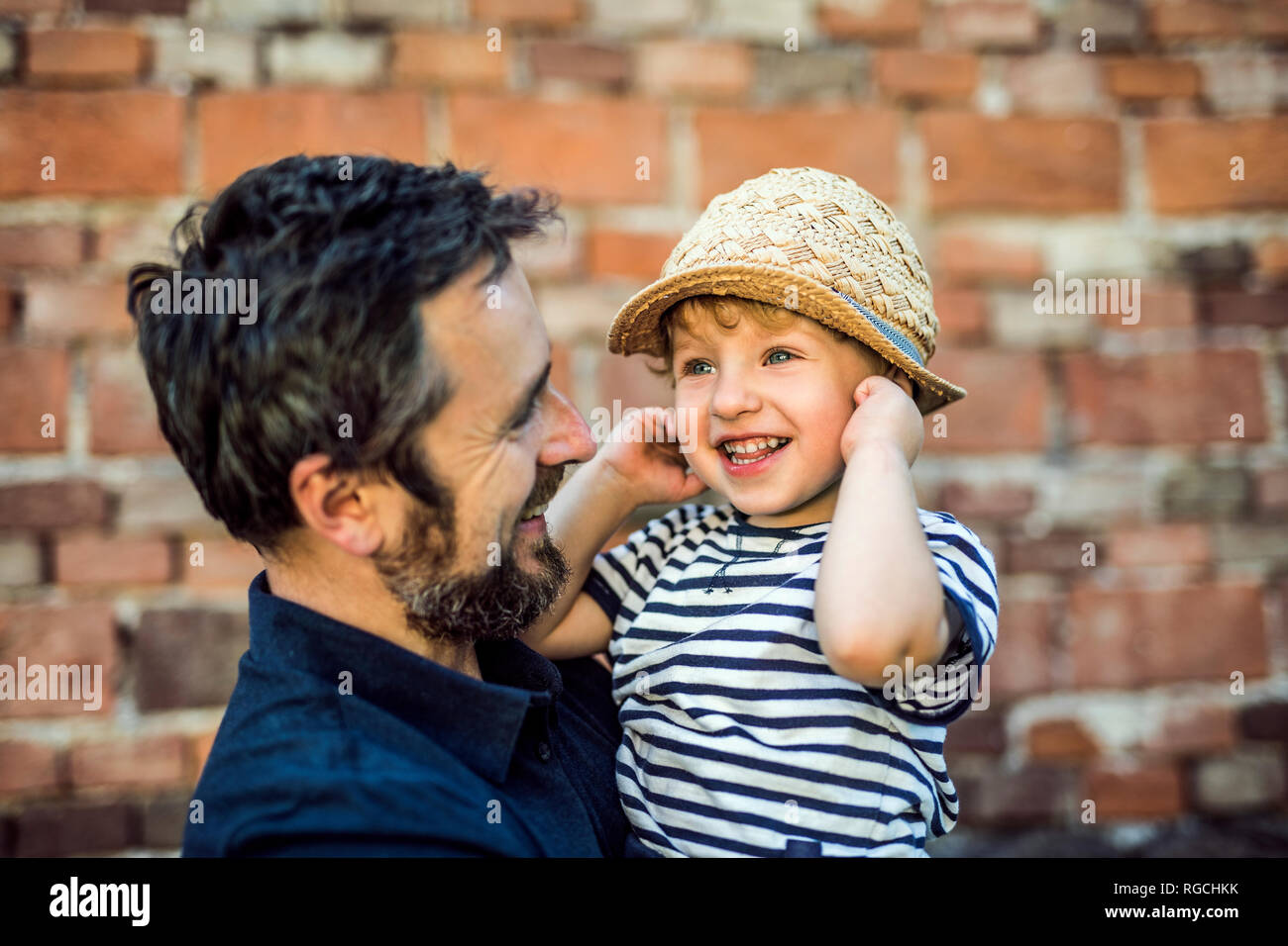 Portrait happy toddler fathers arms hi-res stock photography and images ...