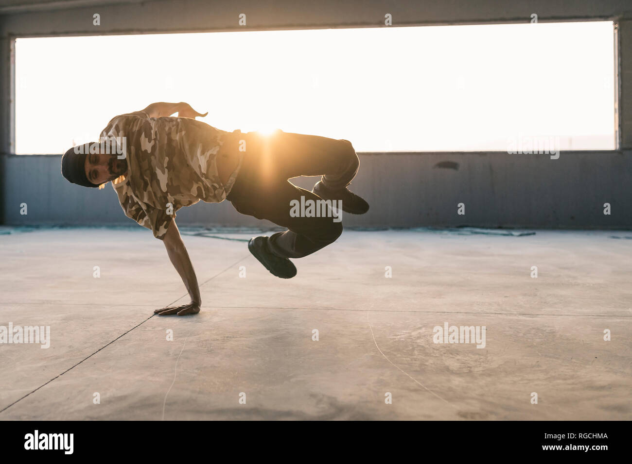 Man doing breakdance urban concrete building hi-res stock photography ...