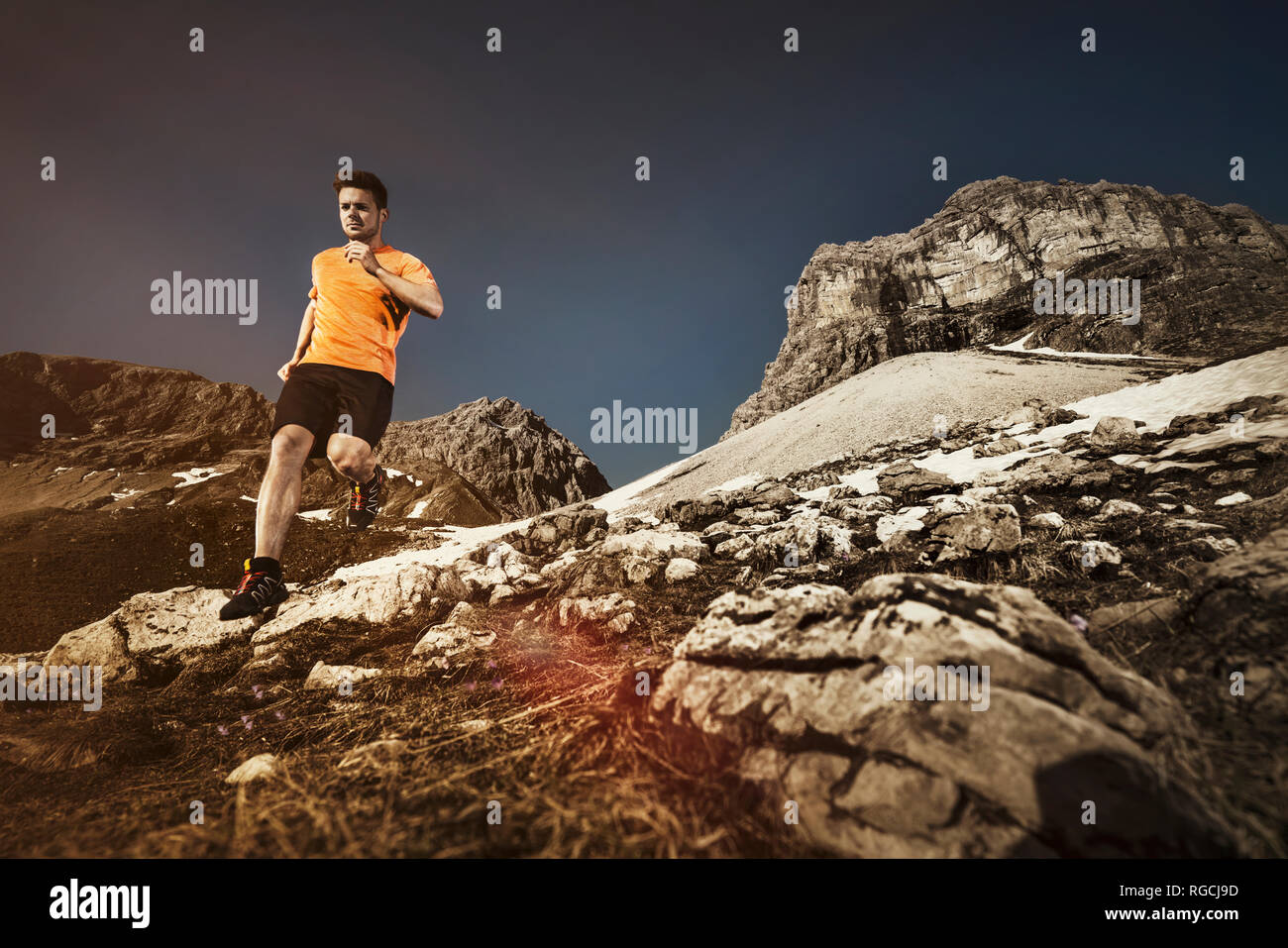Germany, Allgaeu Alps, man running on mountain trail Stock Photo - Alamy