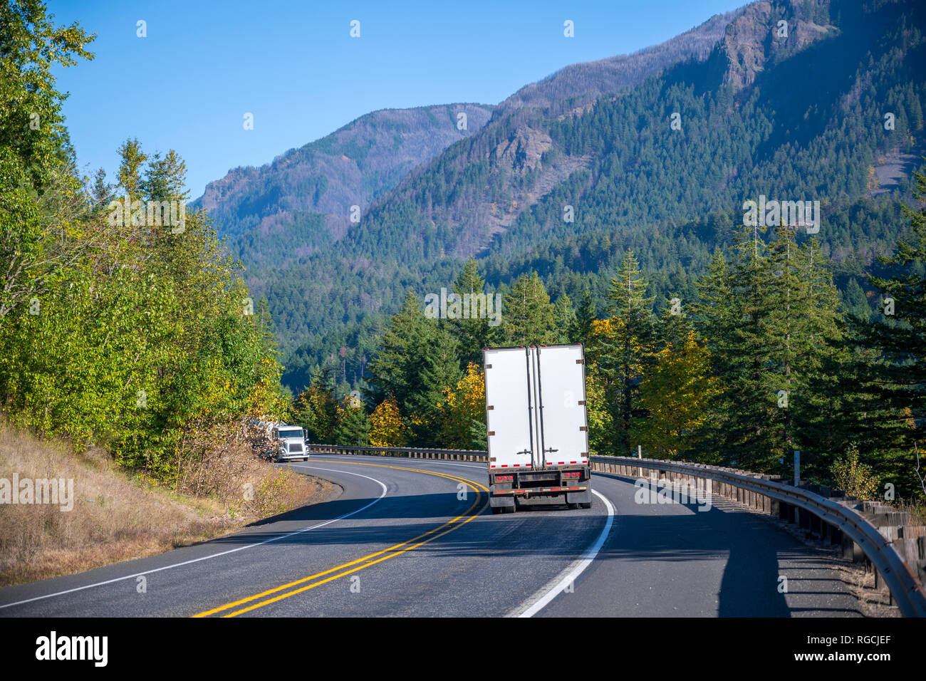 Trucks cars tractor trailers driving hi-res stock photography and ...