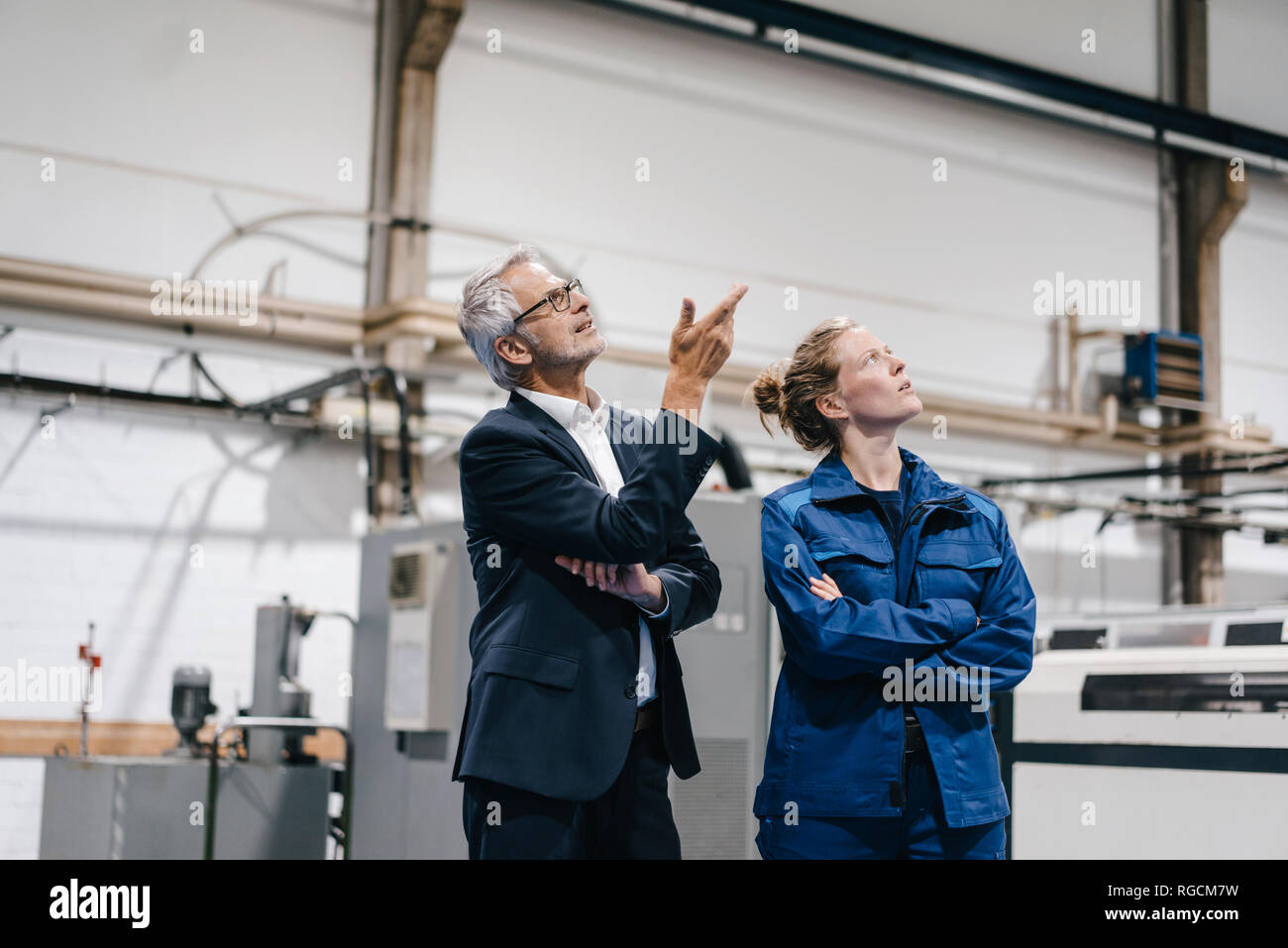 Manager and skilled worker of a high tech enterprise having a meeting ...