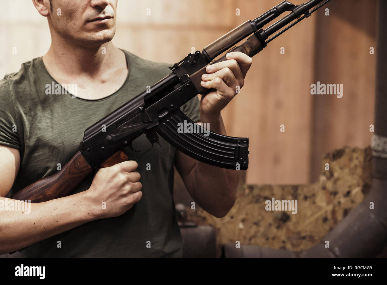 Man holding rifle hi-res stock photography and images - Alamy