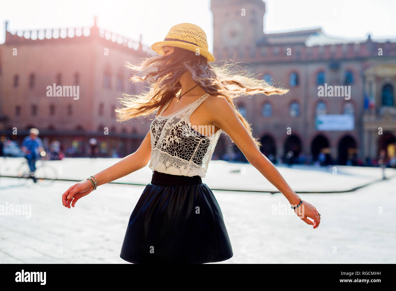 Italy, Bologna, young woman dancing on square Stock Photo - Alamy