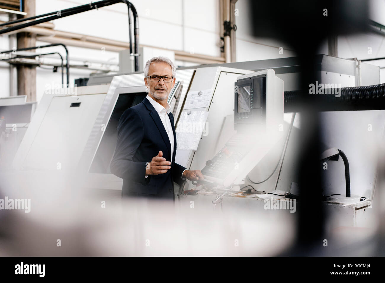 Manager in high tech company using computer Stock Photo - Alamy