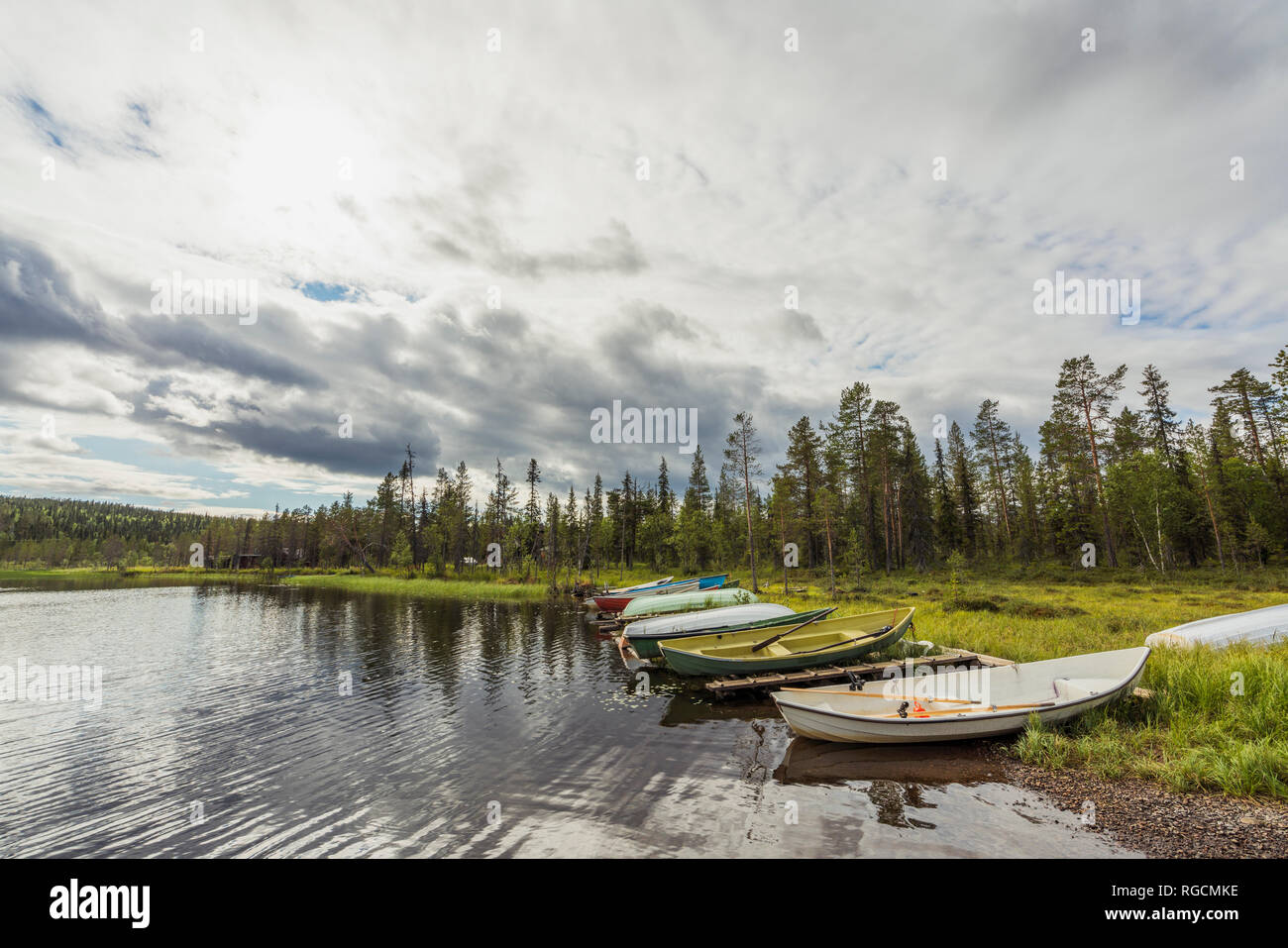 Finland, Lapland, rowing boats at the lakeside Stock Photo - Alamy