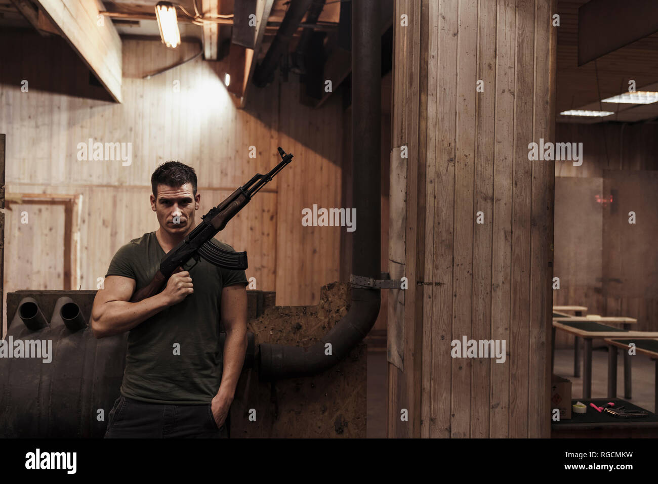 He is holding a rifle in his hand hi-res stock photography and images ...