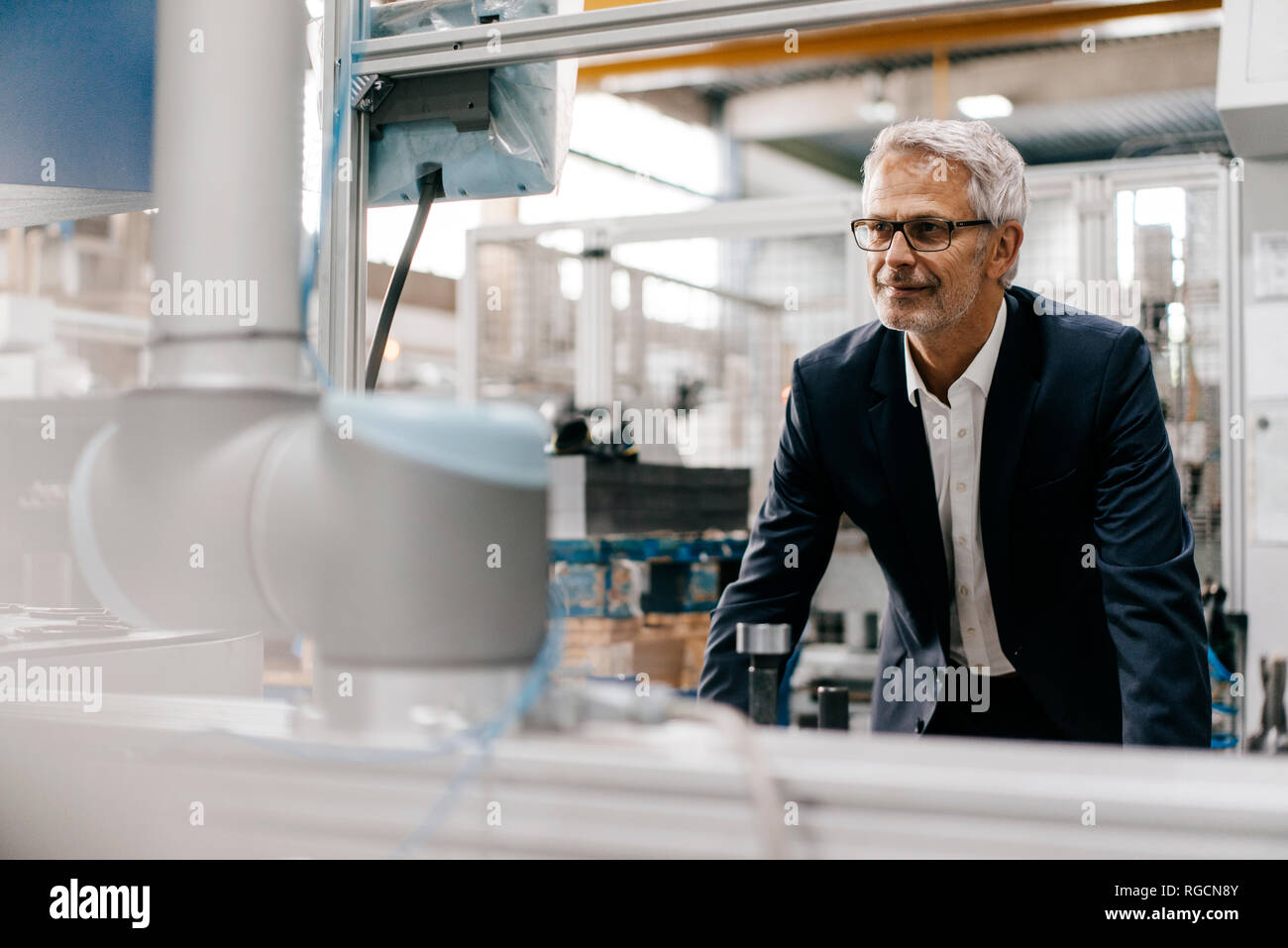 Manager smiling in high tech company Stock Photo - Alamy