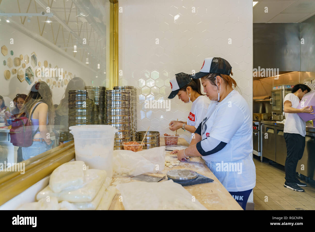 Women working on soup dumpling in store Stock Photo - Alamy